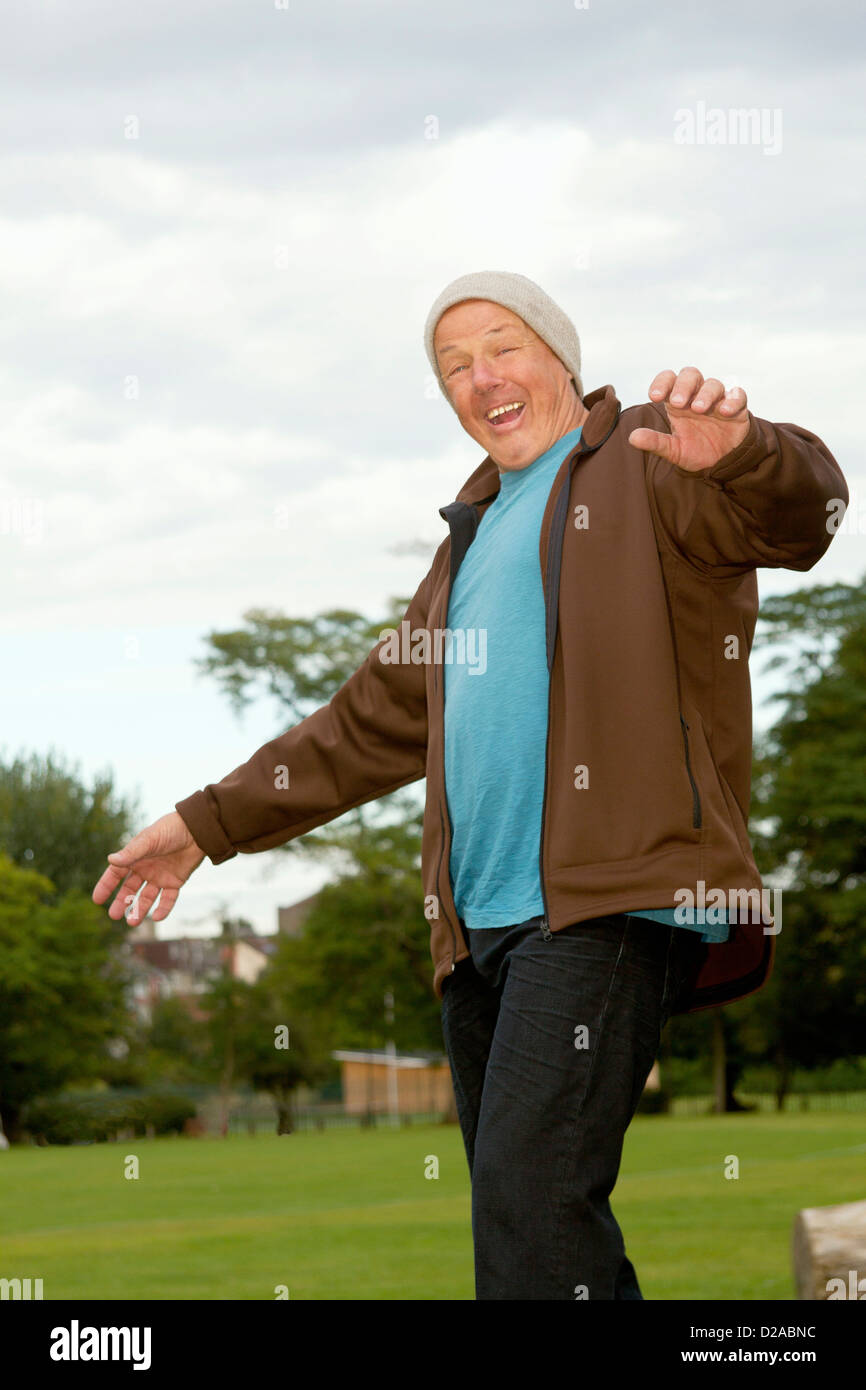 Older man walking outdoors Stock Photo - Alamy