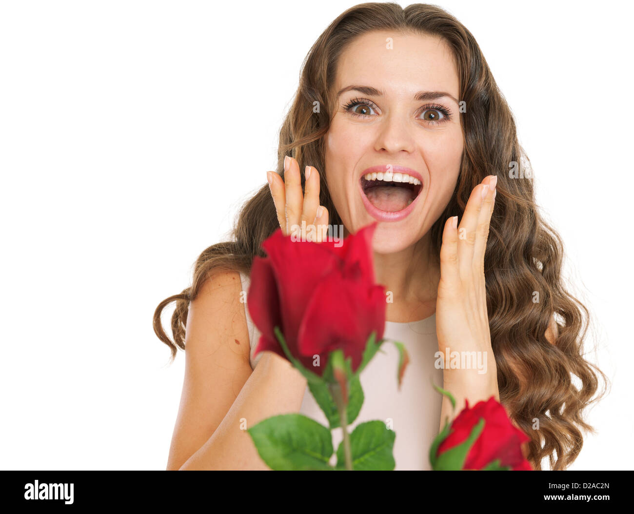 Surprised young woman receiving red roses Stock Photo - Alamy