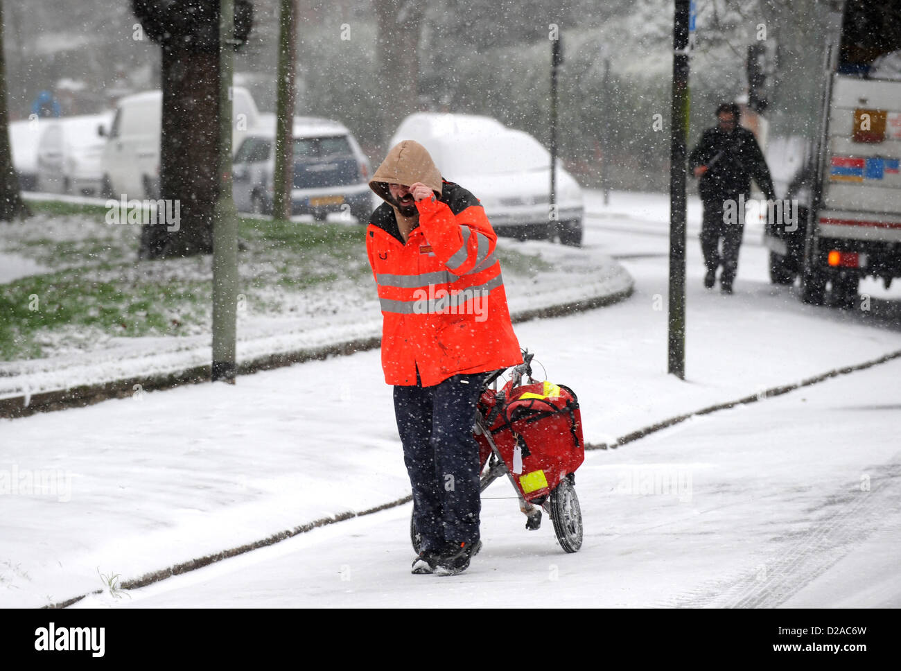 Postman delivering snow hi-res stock photography and images - Alamy