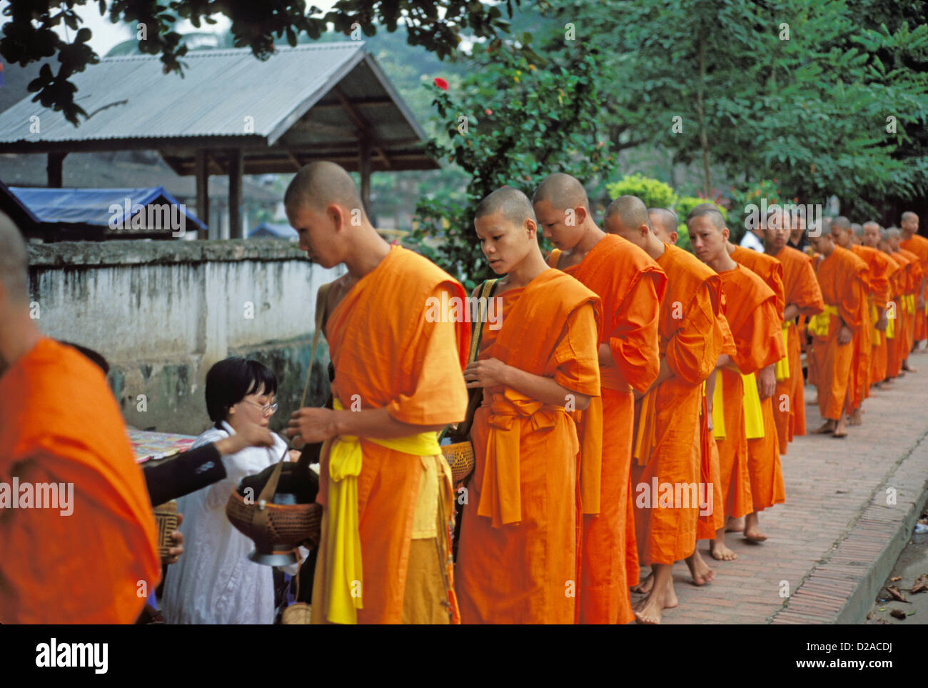 Laos. Luang Prabang. Feeding Monks Stock Photo - Alamy