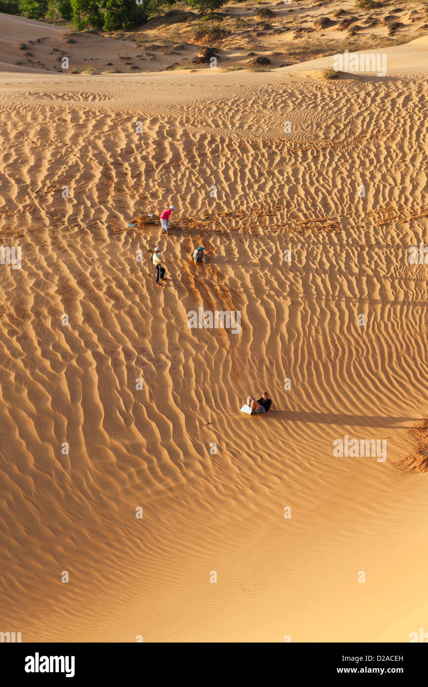 Vietnam, Mui Ne, Sand Dunes, Tourists Sliding on Dunes Stock Photo - Alamy