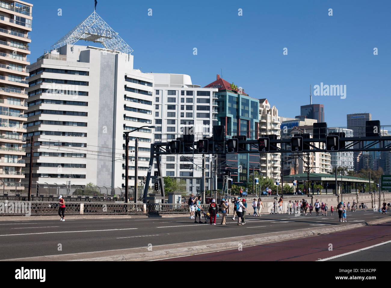 Group of people crossing an almost deserted Sydney Harbour Bridge at ...