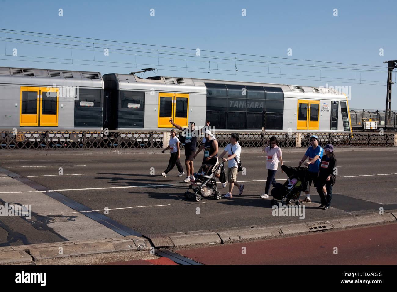 People walking across the Sydney Harbour Bridge during a Charity fun ...