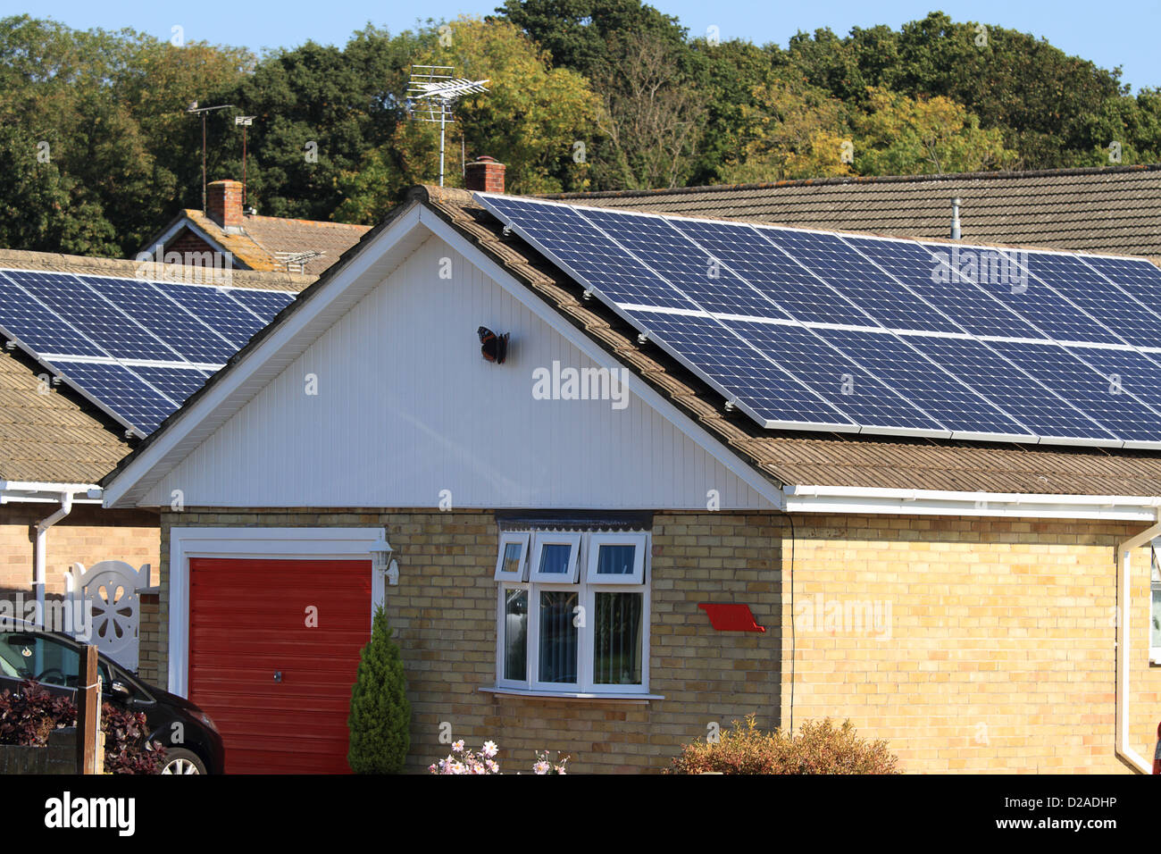 Solar photovoltaic panels on house roofs Stock Photo - Alamy