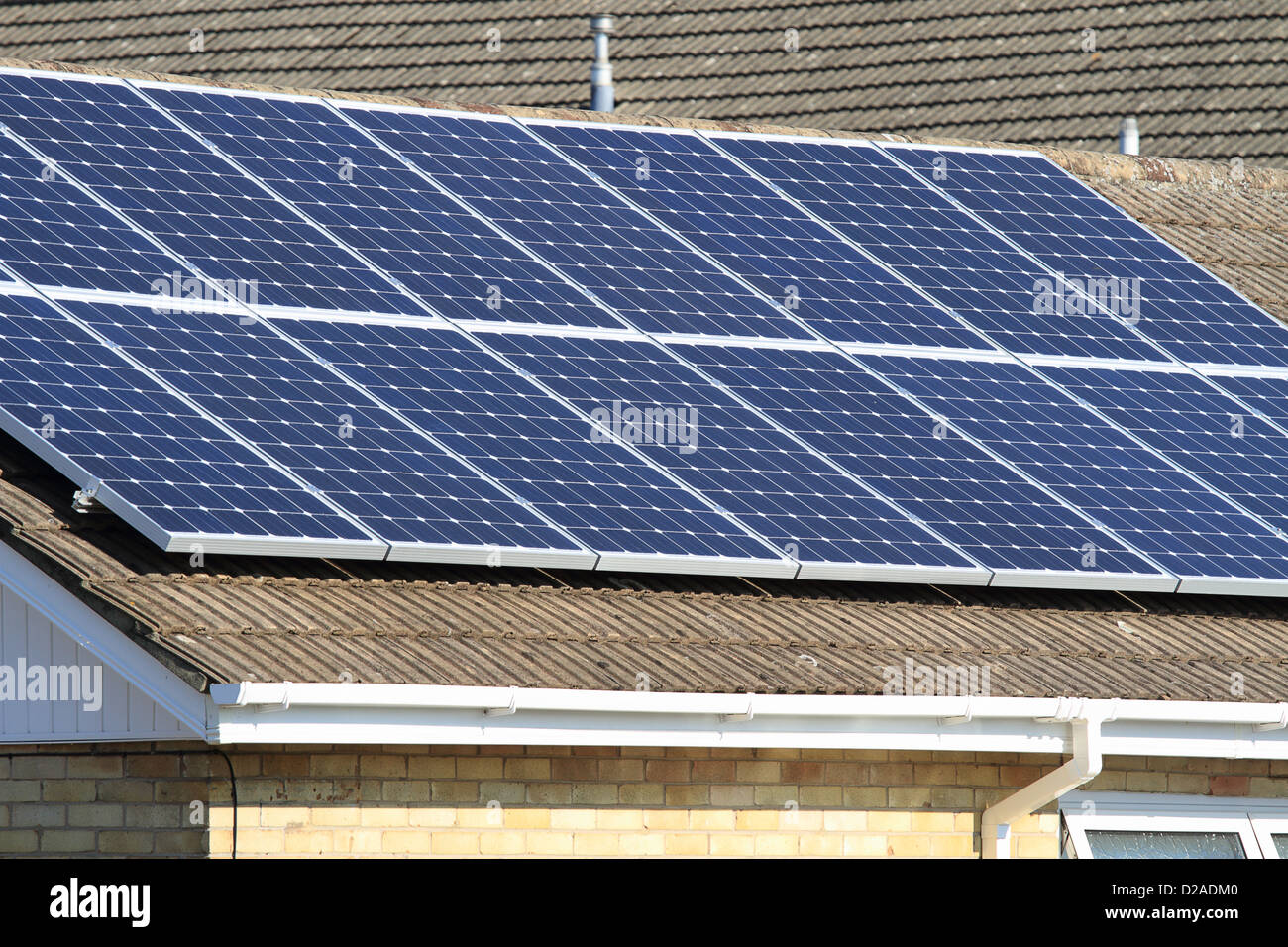 Solar photovoltaic panels on house roof Stock Photo - Alamy