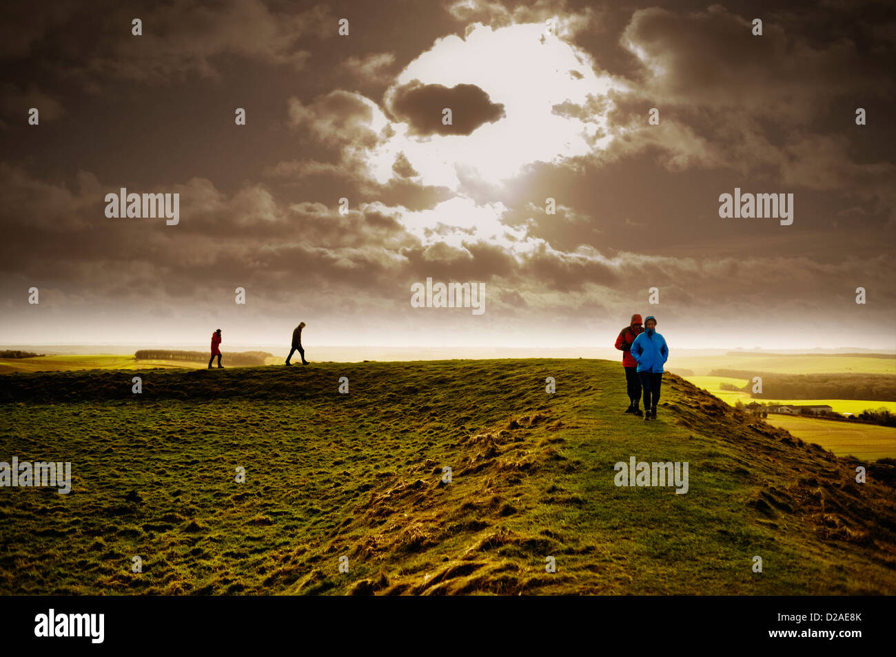 Walking the bank of an Bronze Age hill fort at Uffington, Oxfordshire ...