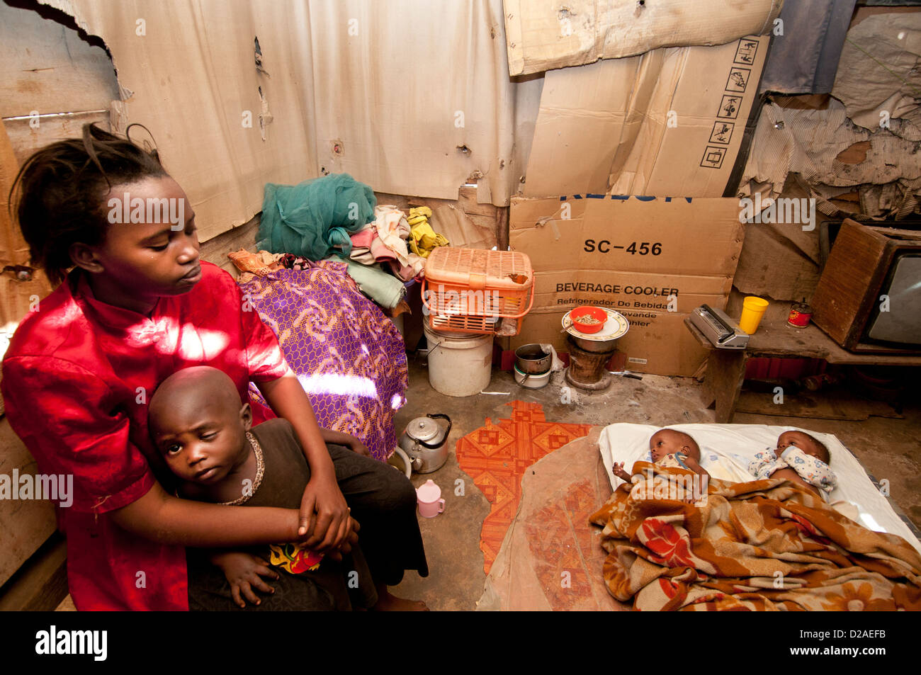 Uganda.Kampala - Namuwongo area . Cramped home with twins Stock Photo ...