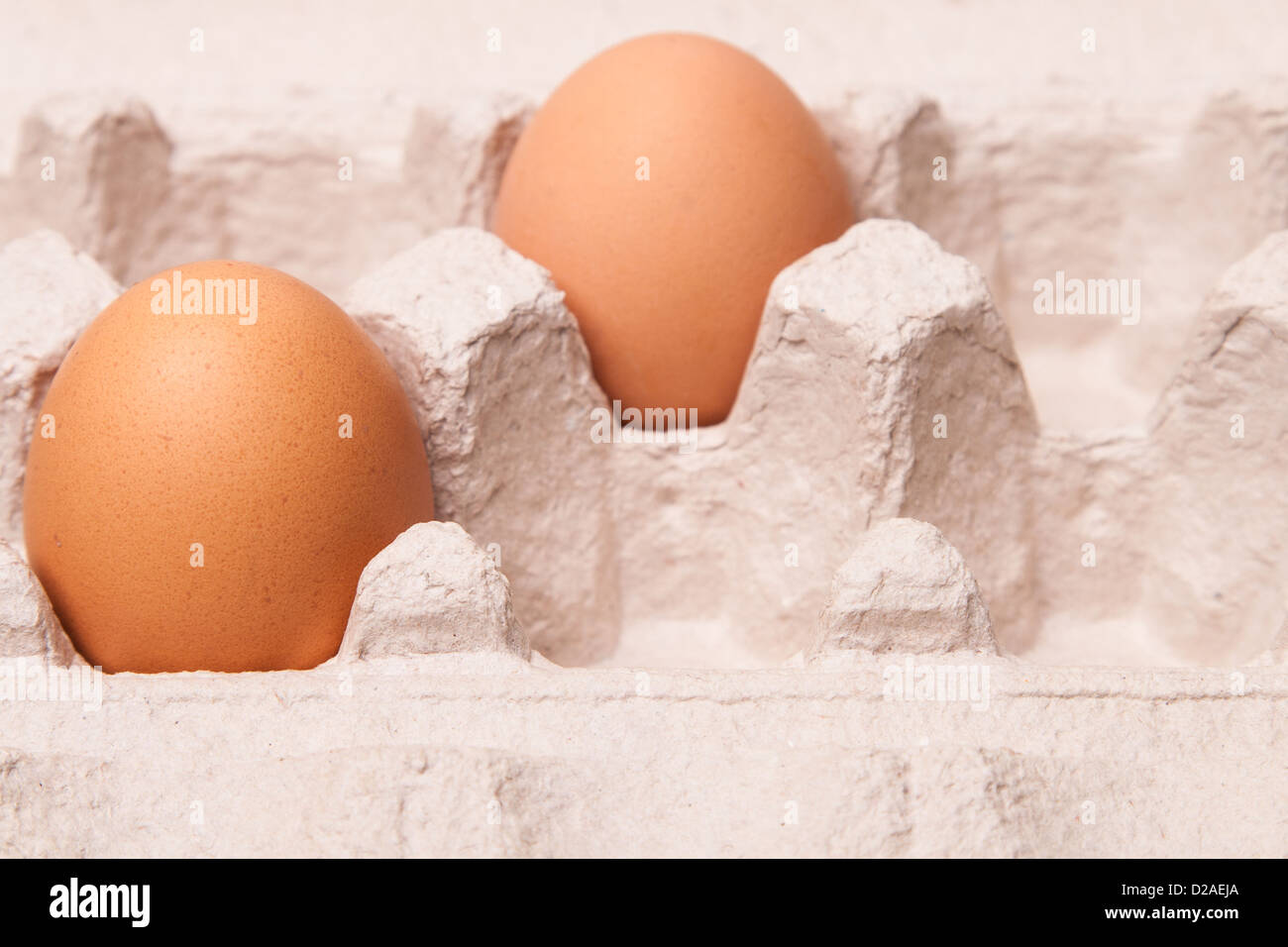 many fresh yellow chicken eggs in container Stock Photo - Alamy