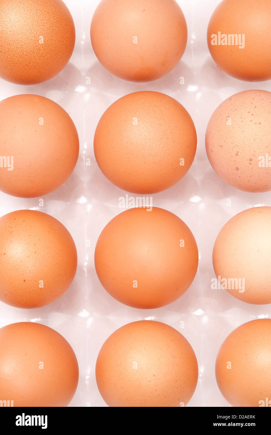 many fresh yellow chicken eggs in container Stock Photo - Alamy