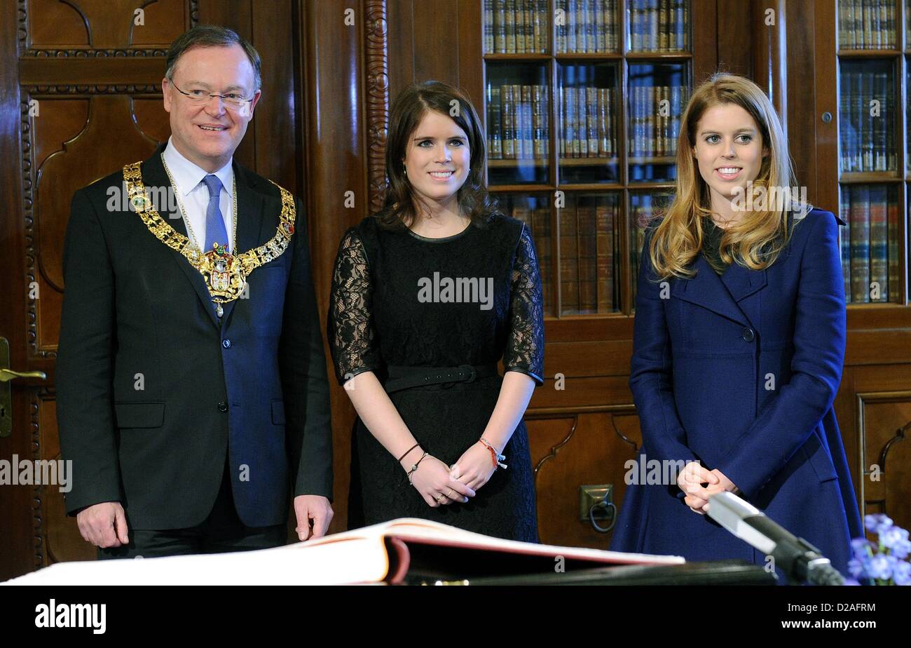 Britain's princesses Eugenie (C) and Beatrice (R) are welcomed by mayor ...