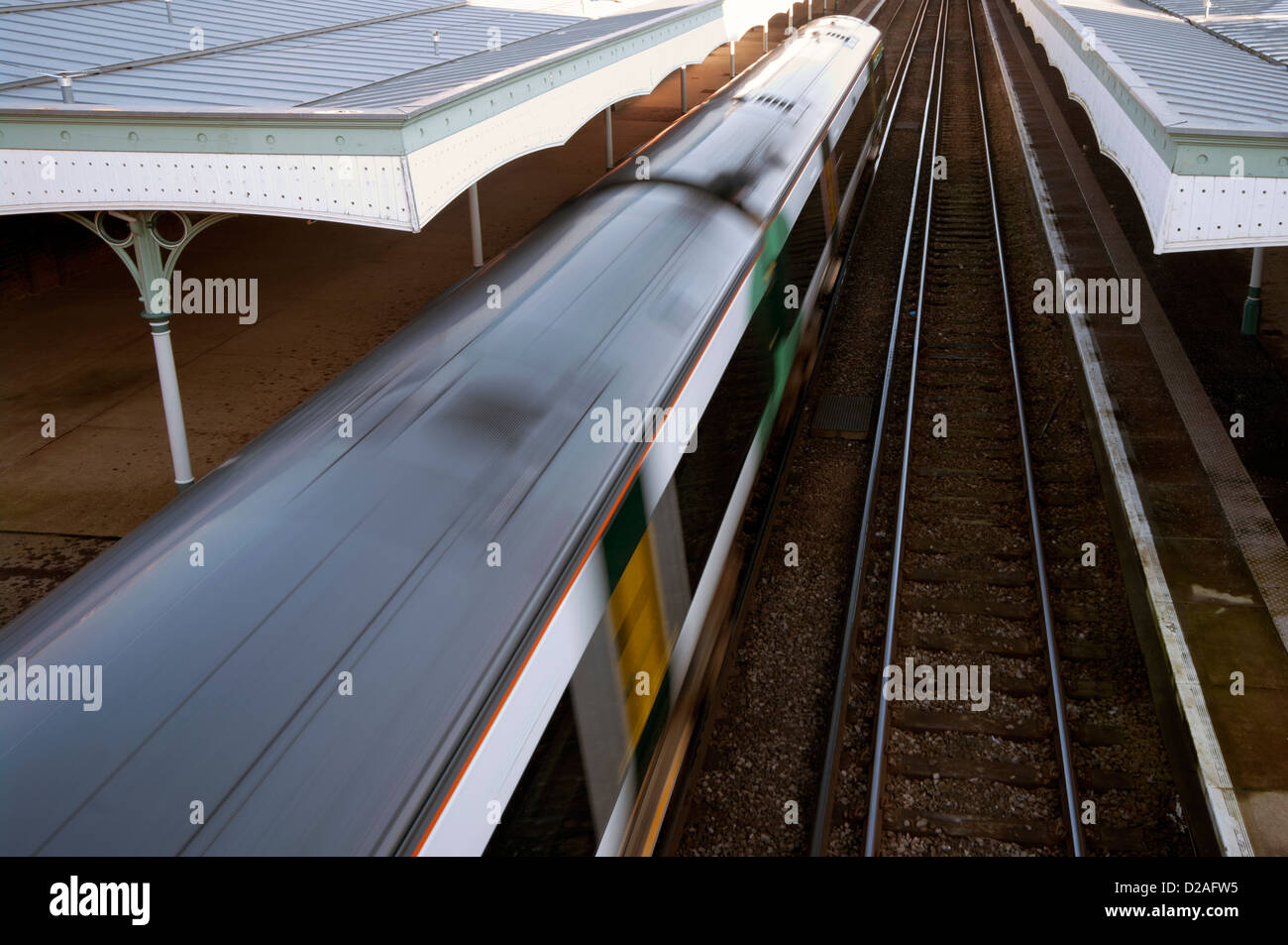 Railway Train Pulling Into a Station With Motion Blur On The Train ...