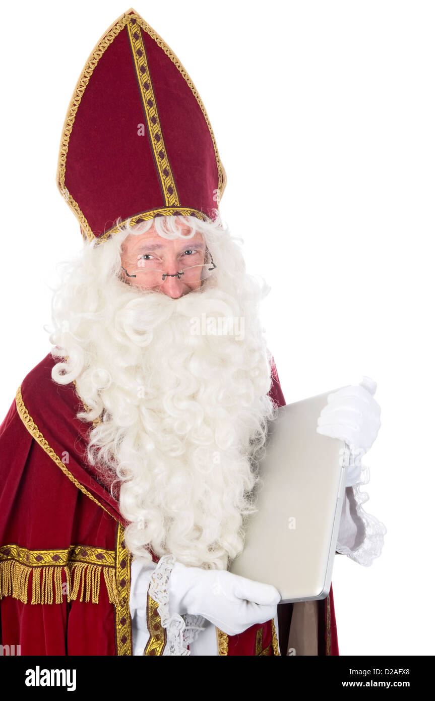 Sinterklaas using a laptop in stead of his book Stock Photo - Alamy