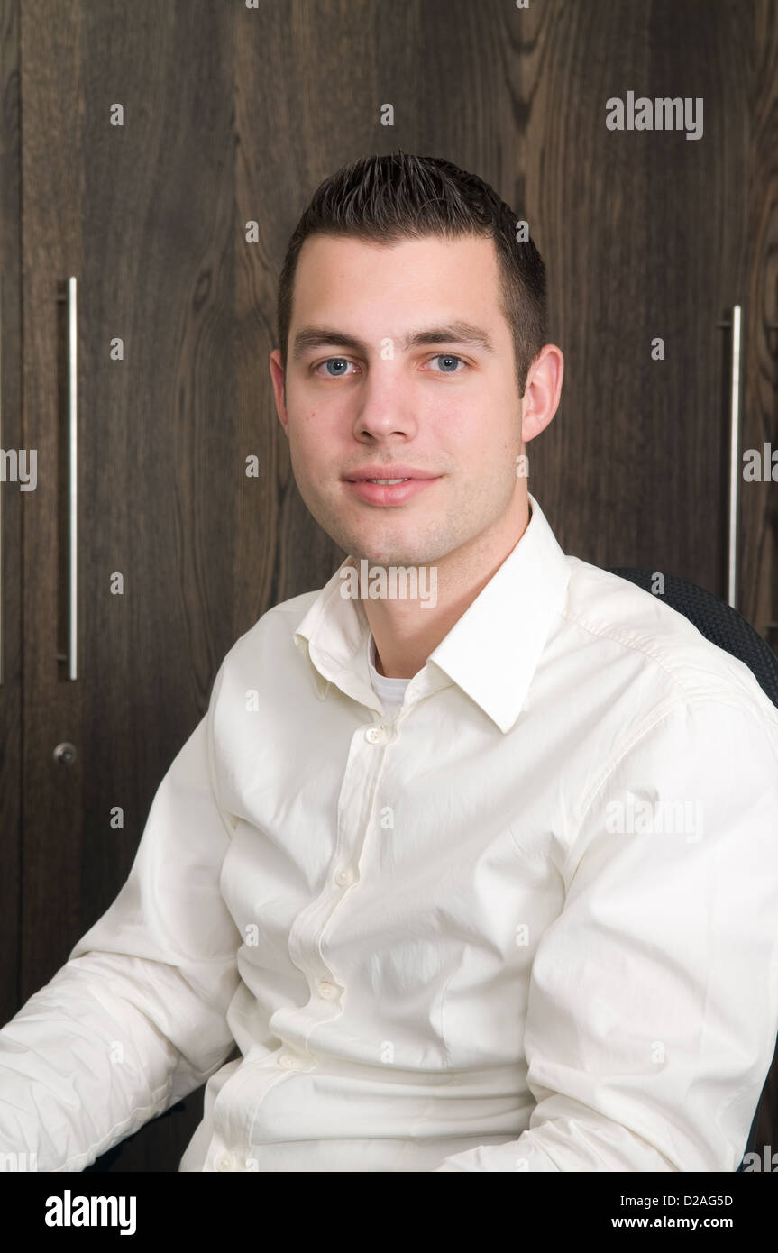 Portrait of a male worker in an office Stock Photo - Alamy