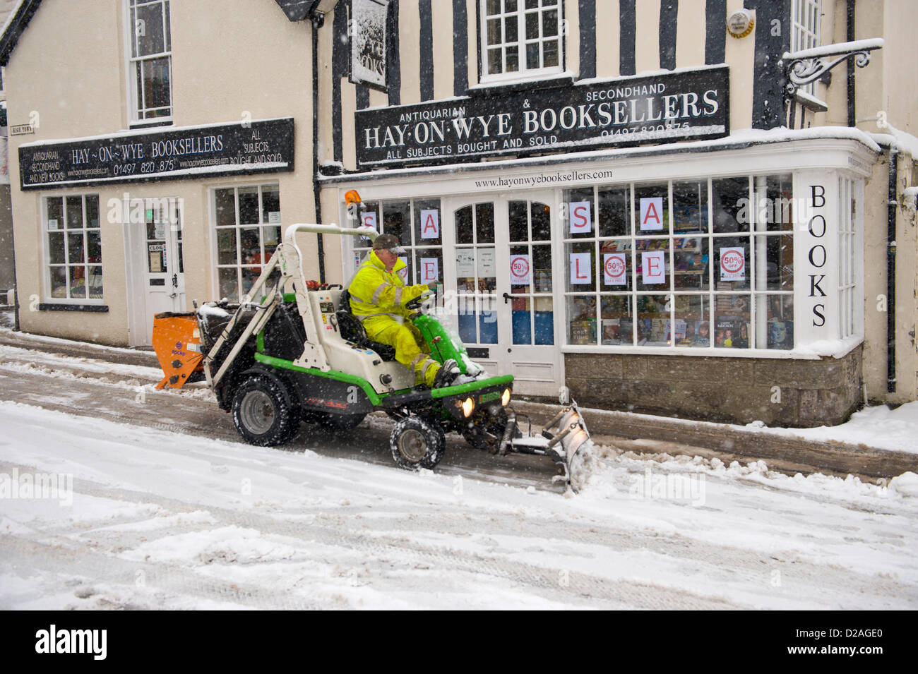 Powys County Council worker using mini snow plough for gritting and ...