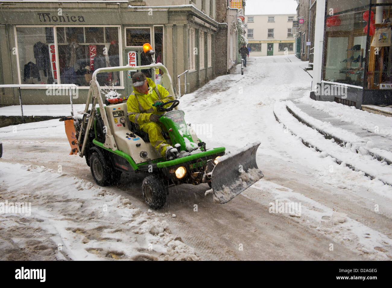 Powys County Council worker using mini snow plough for gritting and ...