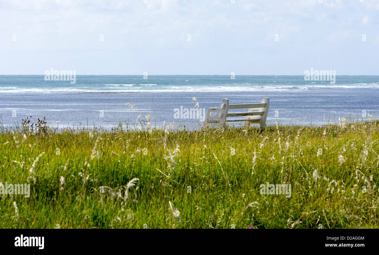 Bench by sea summer time Stock Photo - Alamy