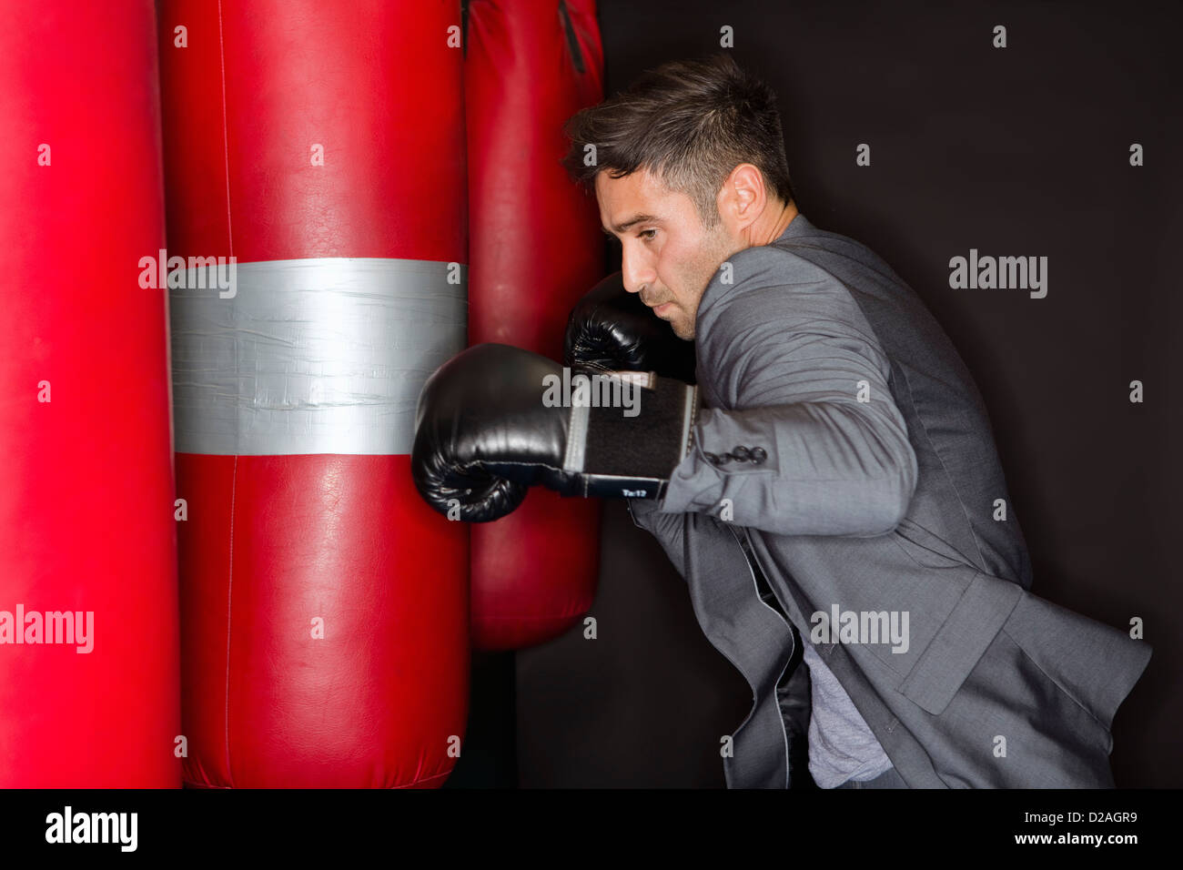 Boxer training with punching bag Stock Photo - Alamy