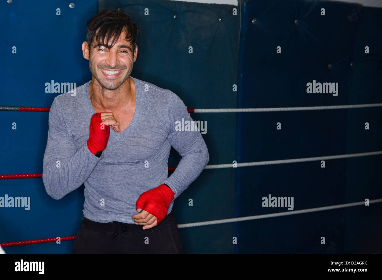 Smiling boxer standing in ring Stock Photo - Alamy