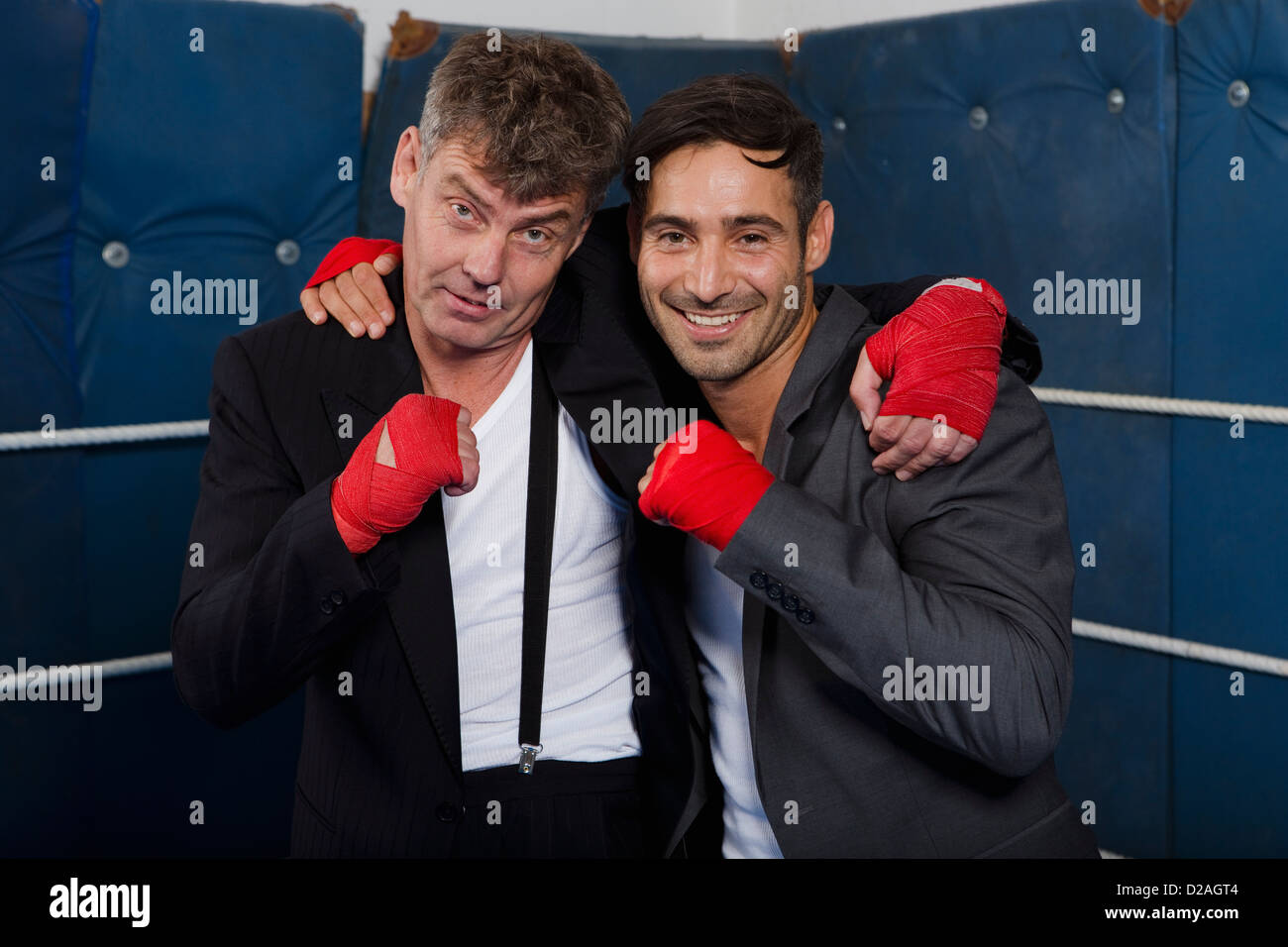 Smiling boxers hugging in ring Stock Photo - Alamy