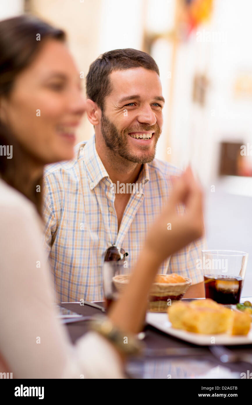 Friends talking at dinner Stock Photo - Alamy