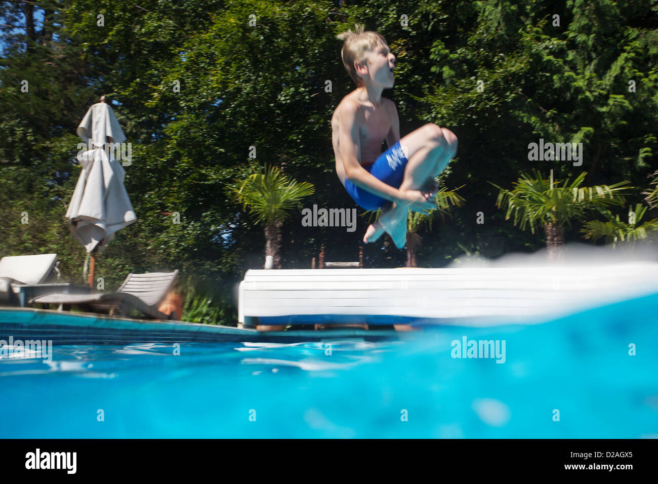 Jumping Into Pool With Clothes Stock Photos & Jumping Into Pool With ...