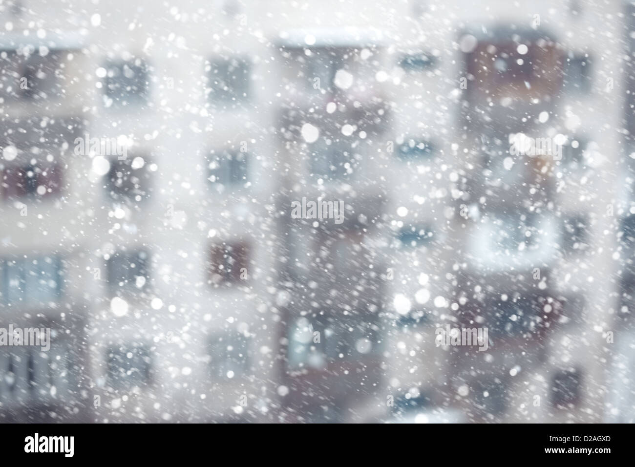 Abstract photo of the snowstorm and residential building on a ...
