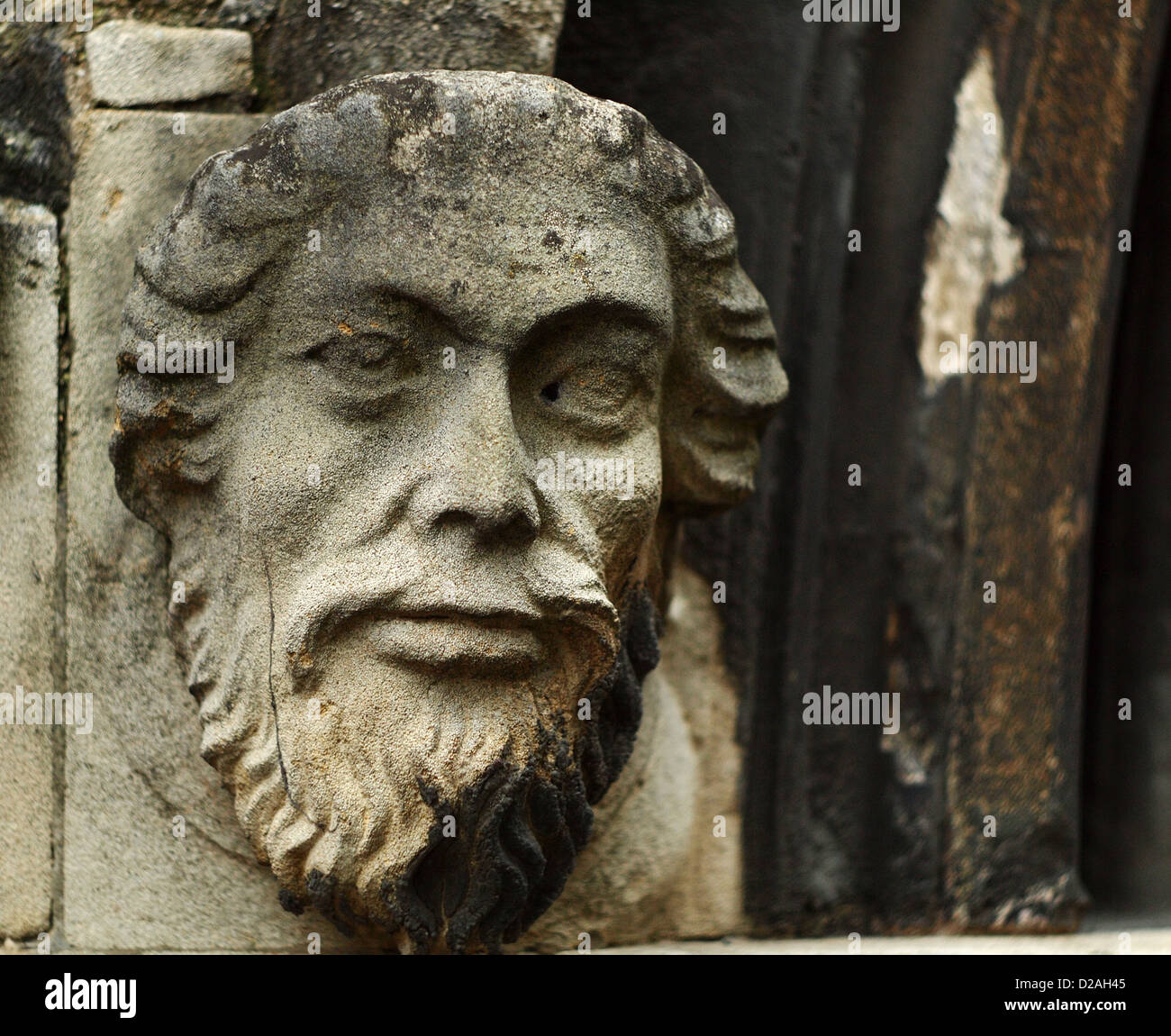 Gargoyle beside church door, close-up of man's face Stock Photo - Alamy
