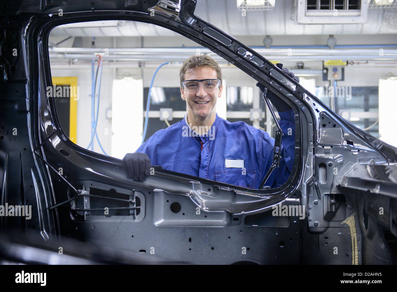 Smiling automotive assembly line worker hi-res stock photography and ...