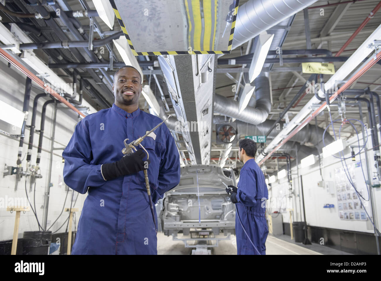 Smiling automotive assembly line worker hi-res stock photography and ...