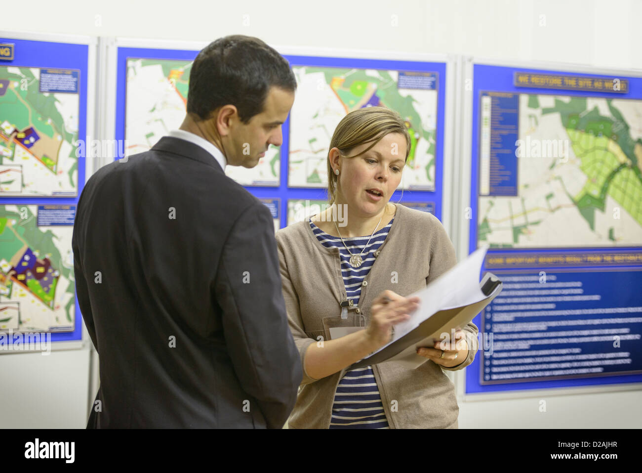 Woman talking with town hall staff Stock Photo - Alamy