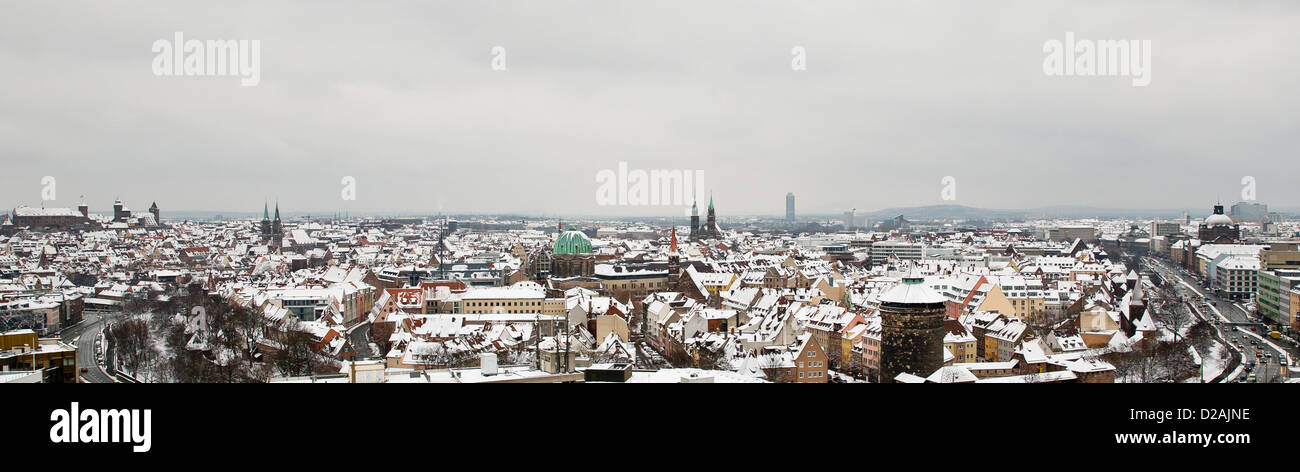 The roofs of the historic old town are covered in snow in Nuremberg ...
