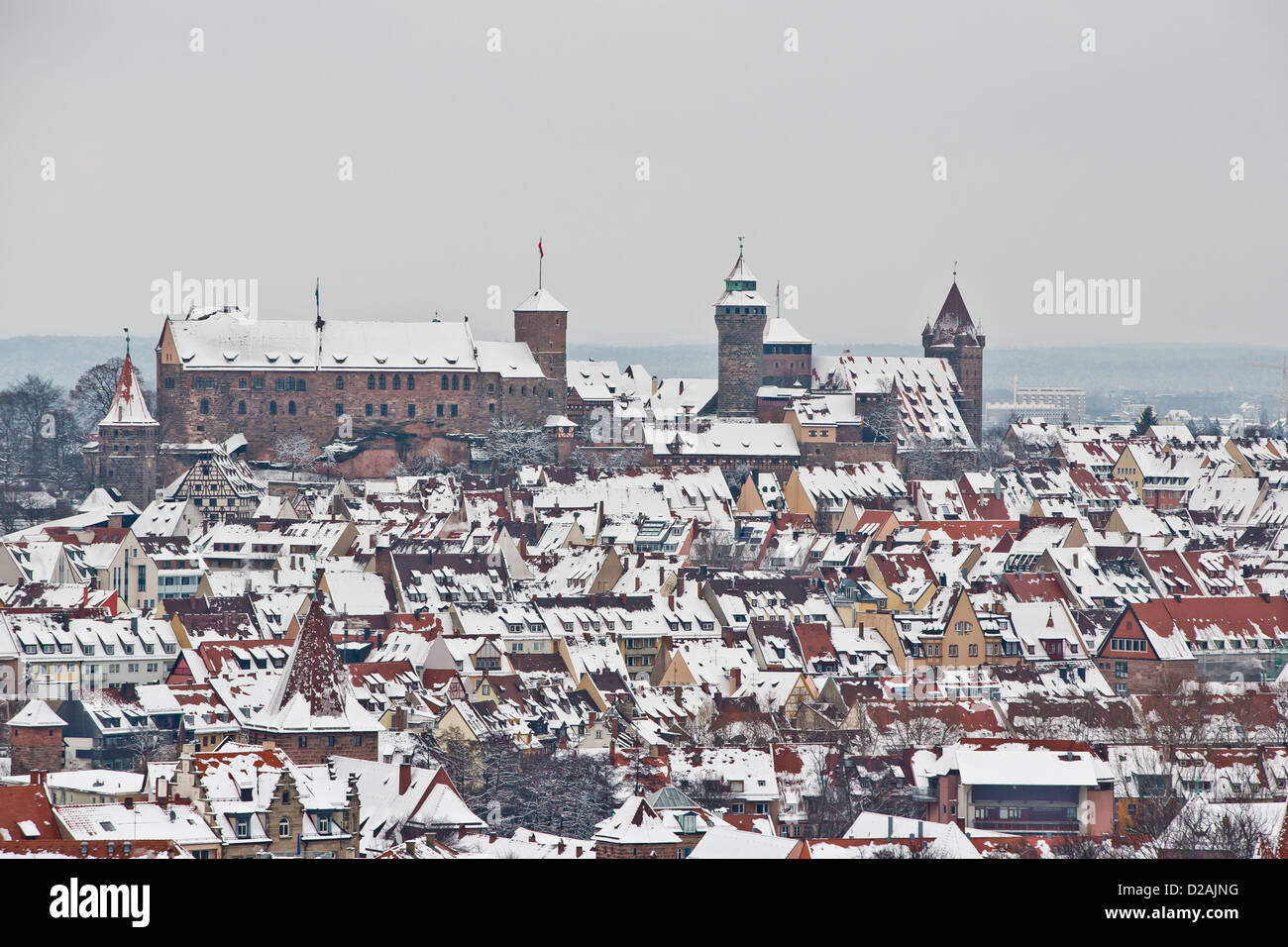 The roofs of the historic old town are covered in snow in Nuremberg ...