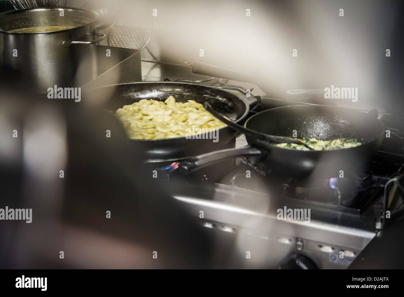 Pans of food cooking on stove Stock Photo - Alamy