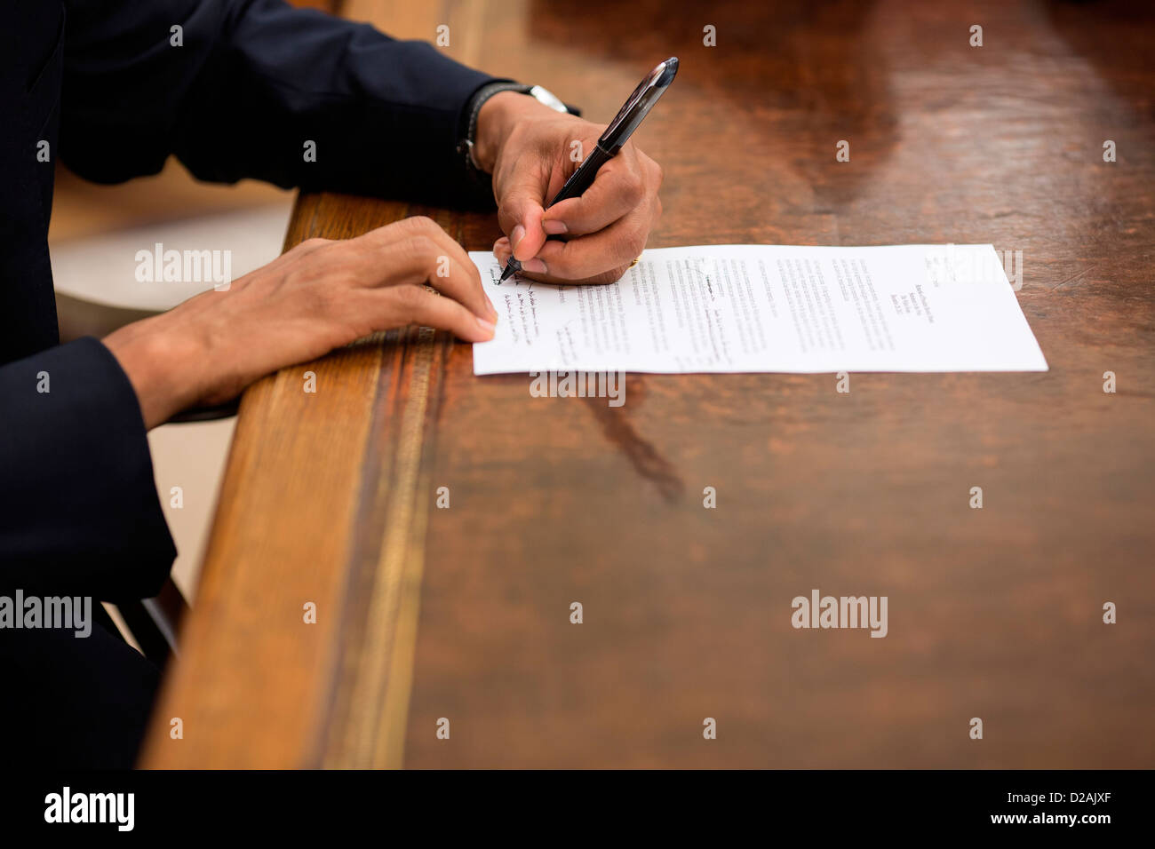 US President Barack Obama edits a statement to the press in the Oval ...