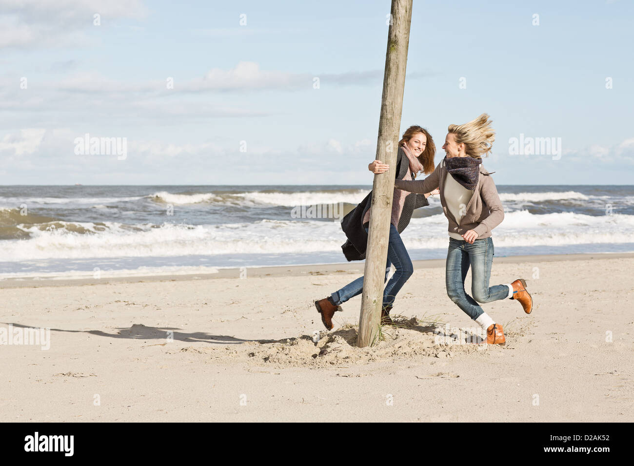 Women playing on beach Stock Photo - Alamy