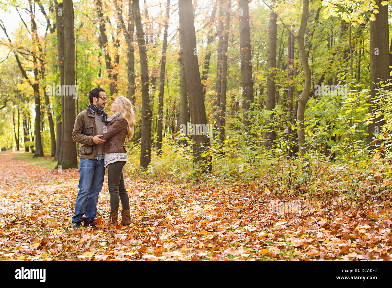 Couple hugging in forest Stock Photo - Alamy