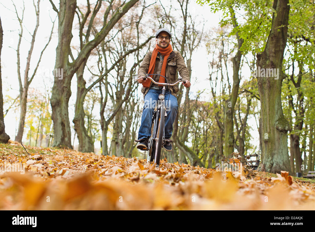 Man riding bicycle in park Stock Photo - Alamy