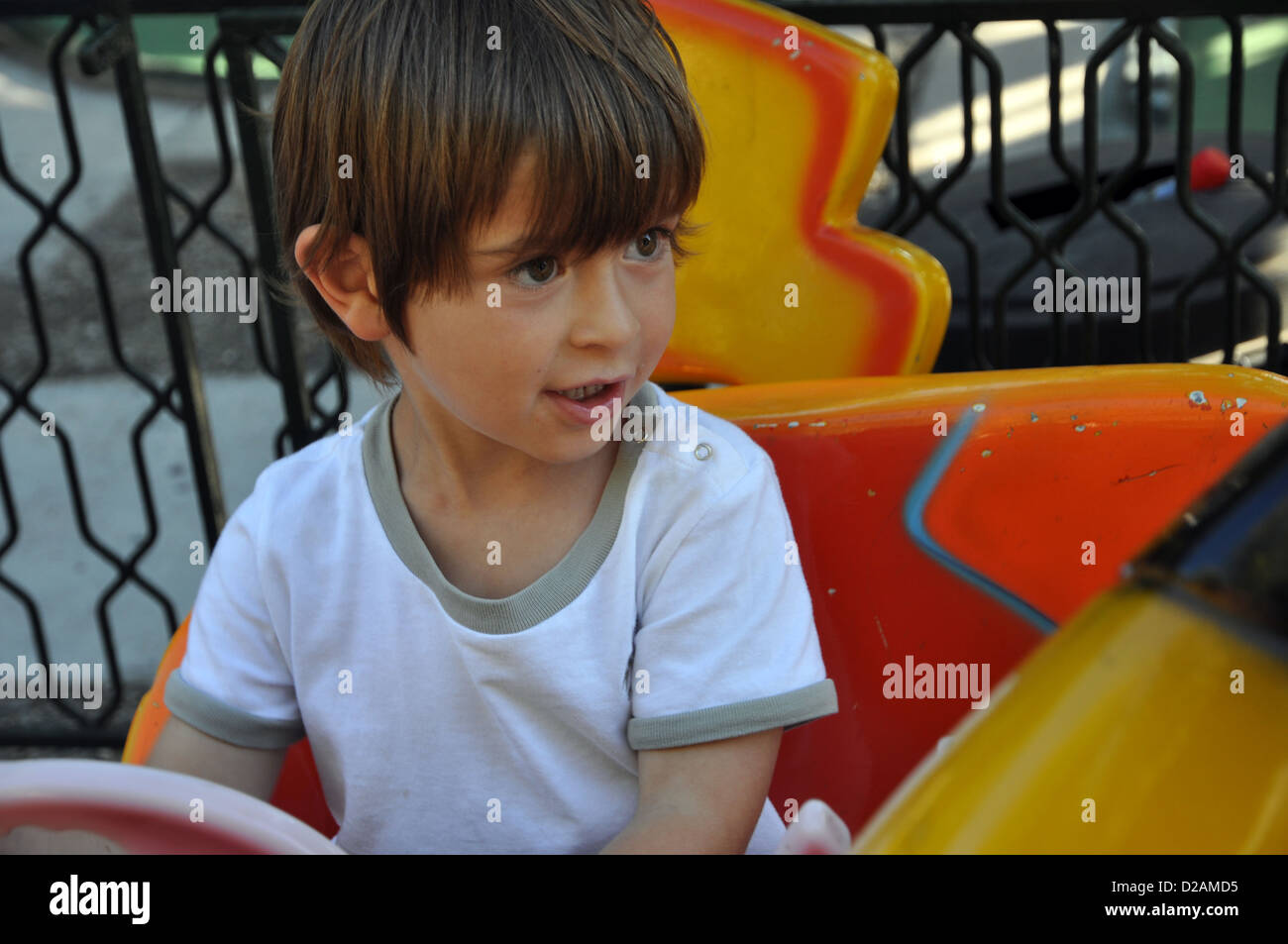 5-years old young boy in a Merry-go-round Car Stock Photo - Alamy
