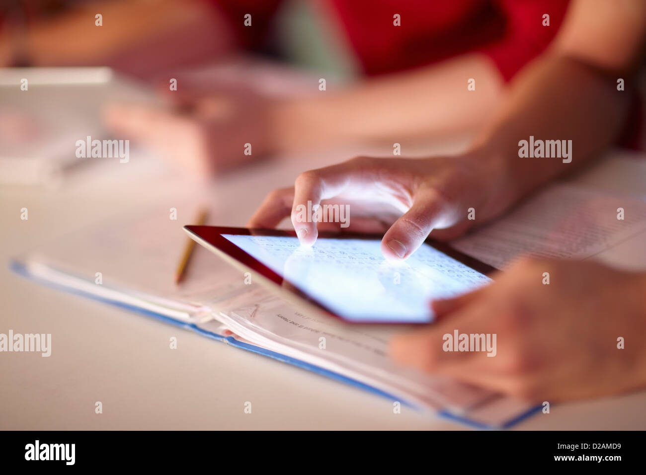 Student using tablet computer in class Stock Photo - Alamy