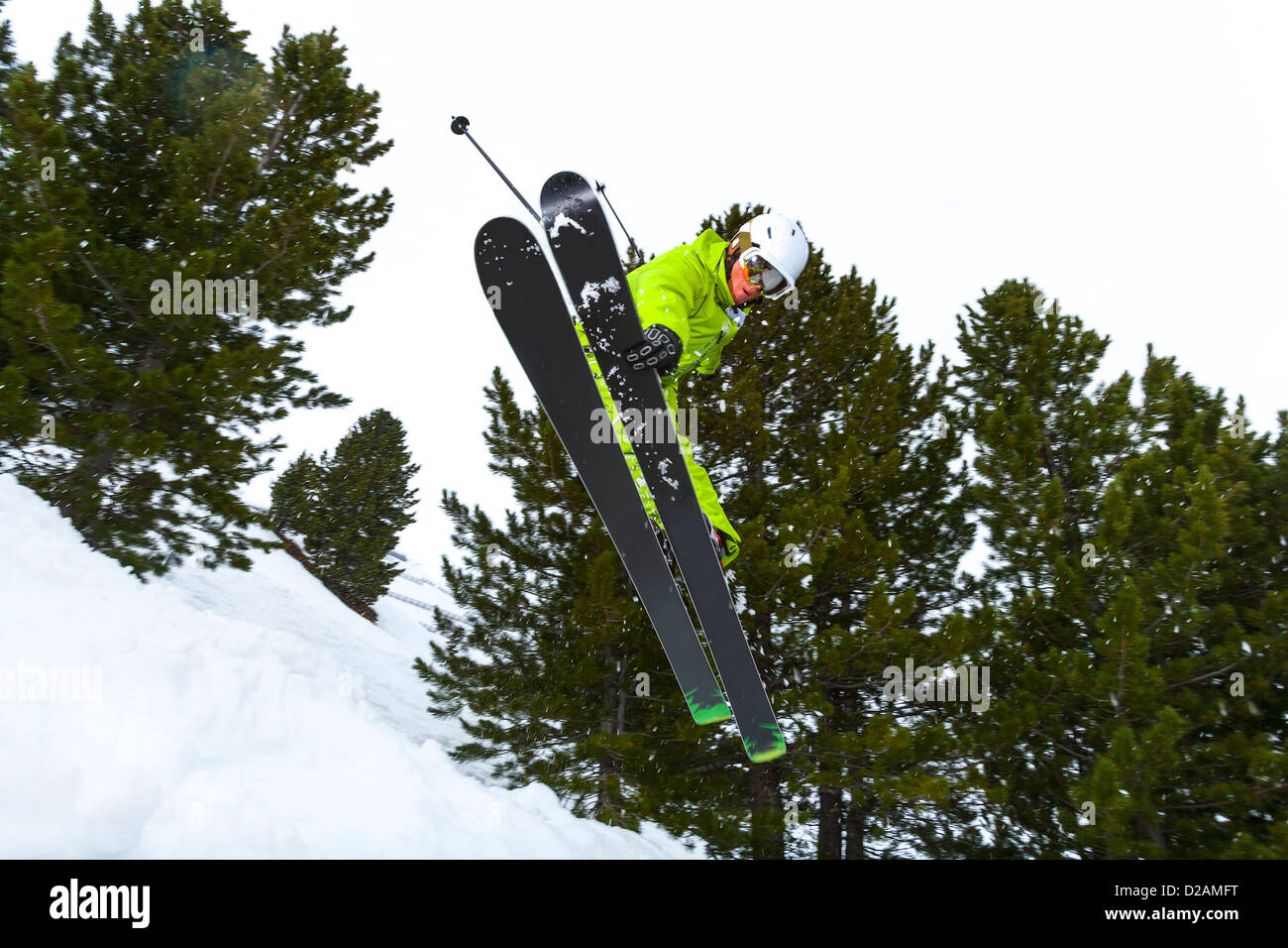 Skier jumping on snowy slope Stock Photo - Alamy