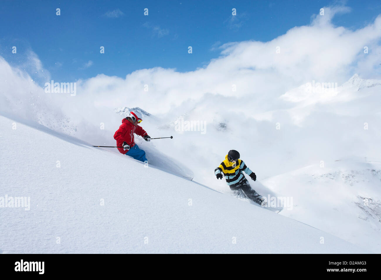 Skier and snowboarder on snowy slope Stock Photo - Alamy