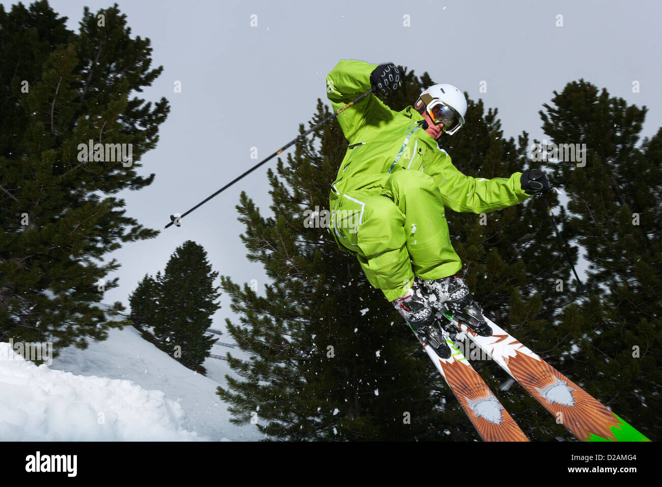 Skier jumping on snowy slope Stock Photo - Alamy