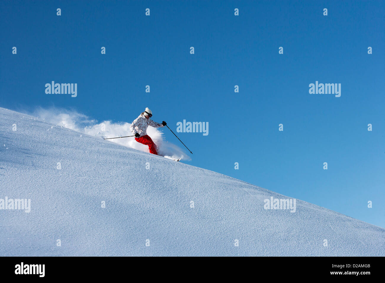 Skier on snowy slope Stock Photo - Alamy