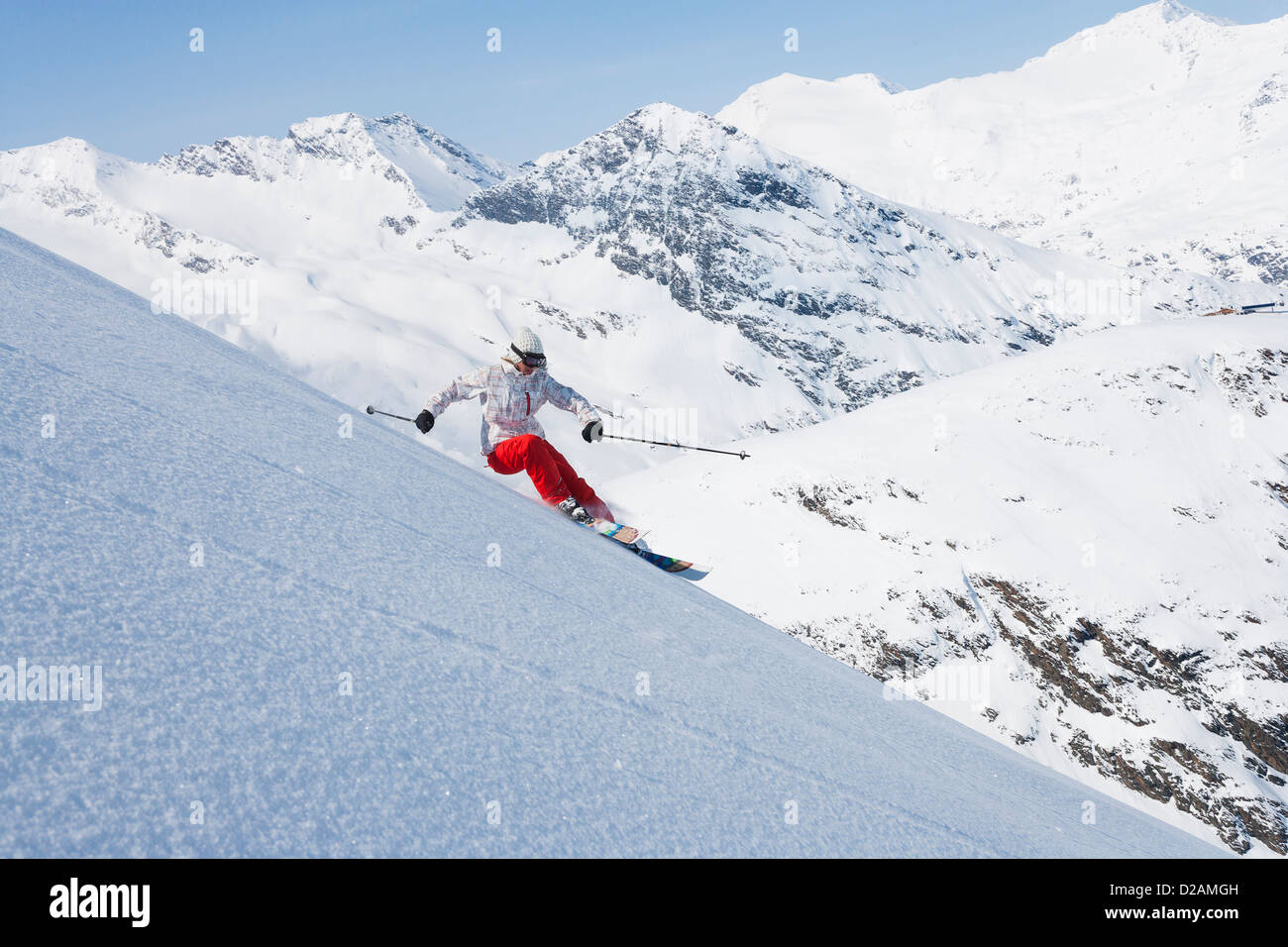 Skier on snowy slope Stock Photo - Alamy