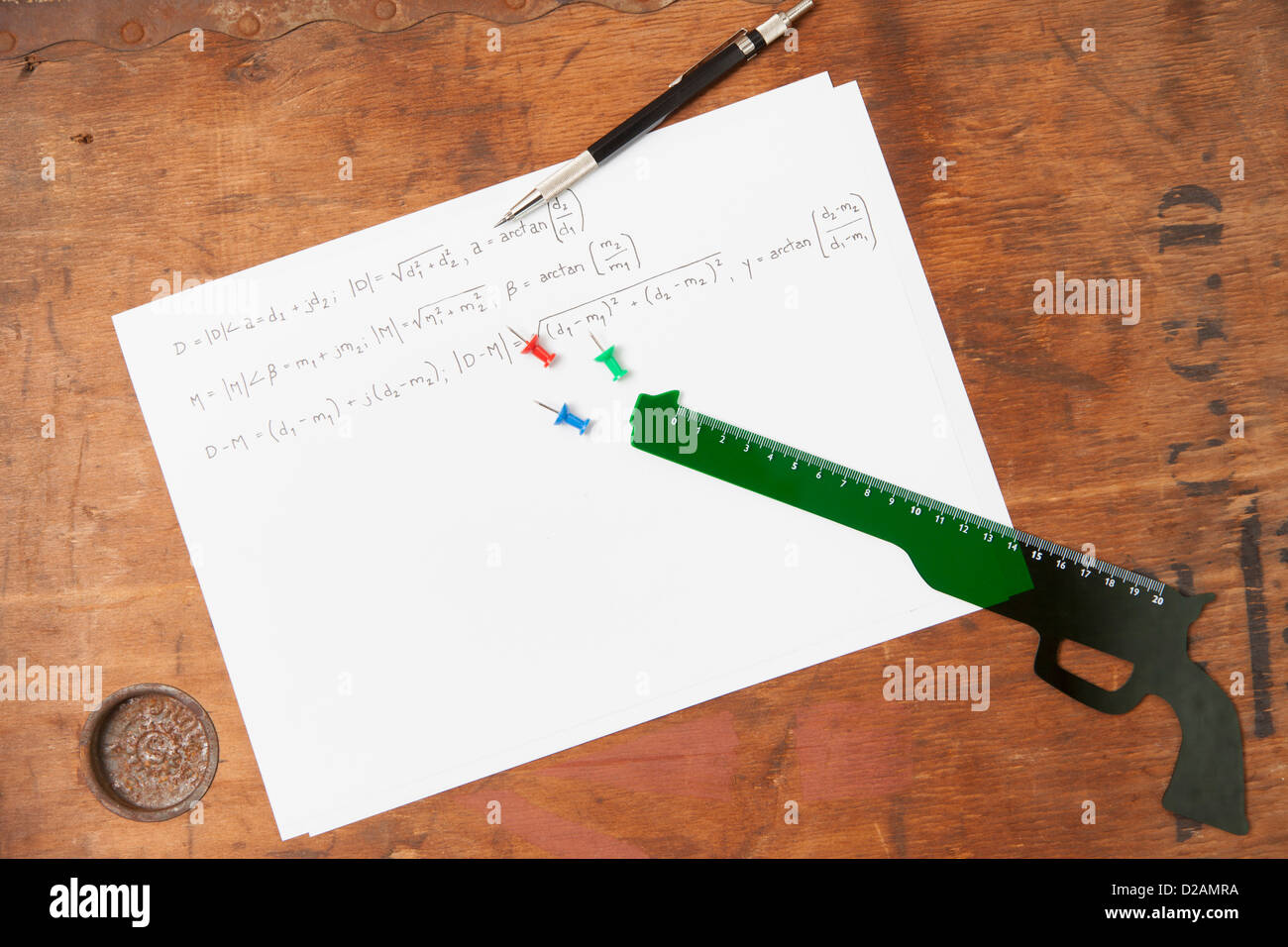 Gun shaped ruler and pen on paper Stock Photo - Alamy