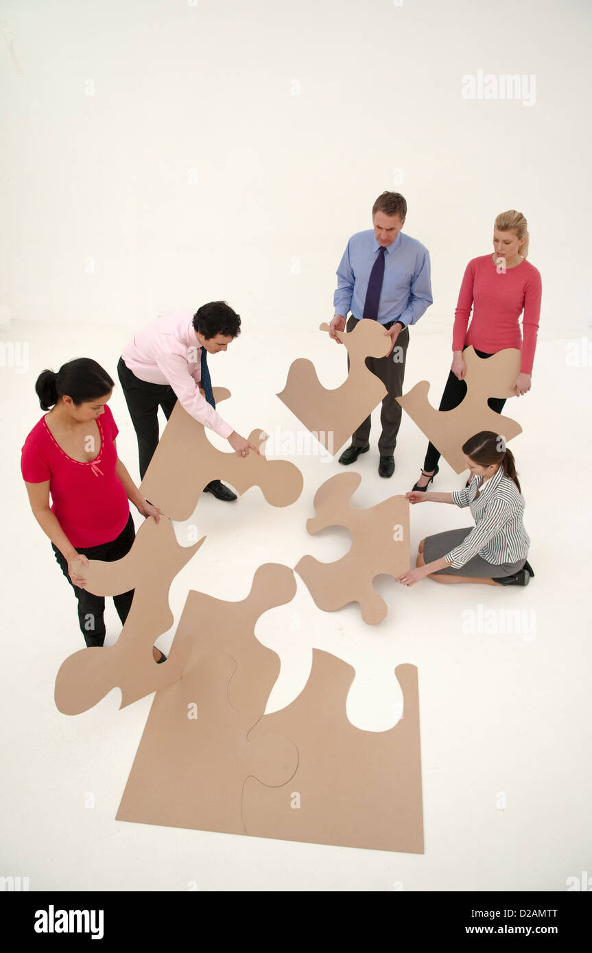 Teamwork Puzzle Building High Resolution Stock Photography and Images ...