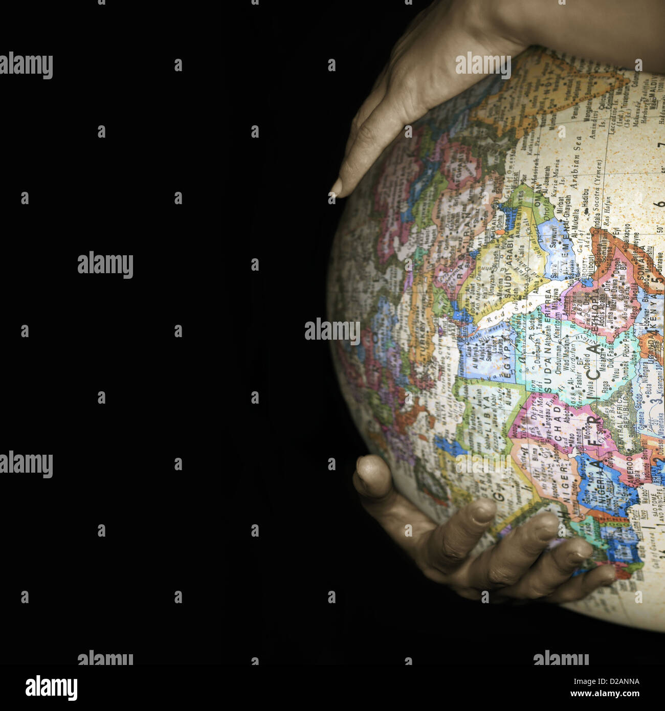 Stomach of the pregnant woman with a texture of a map of the world ...