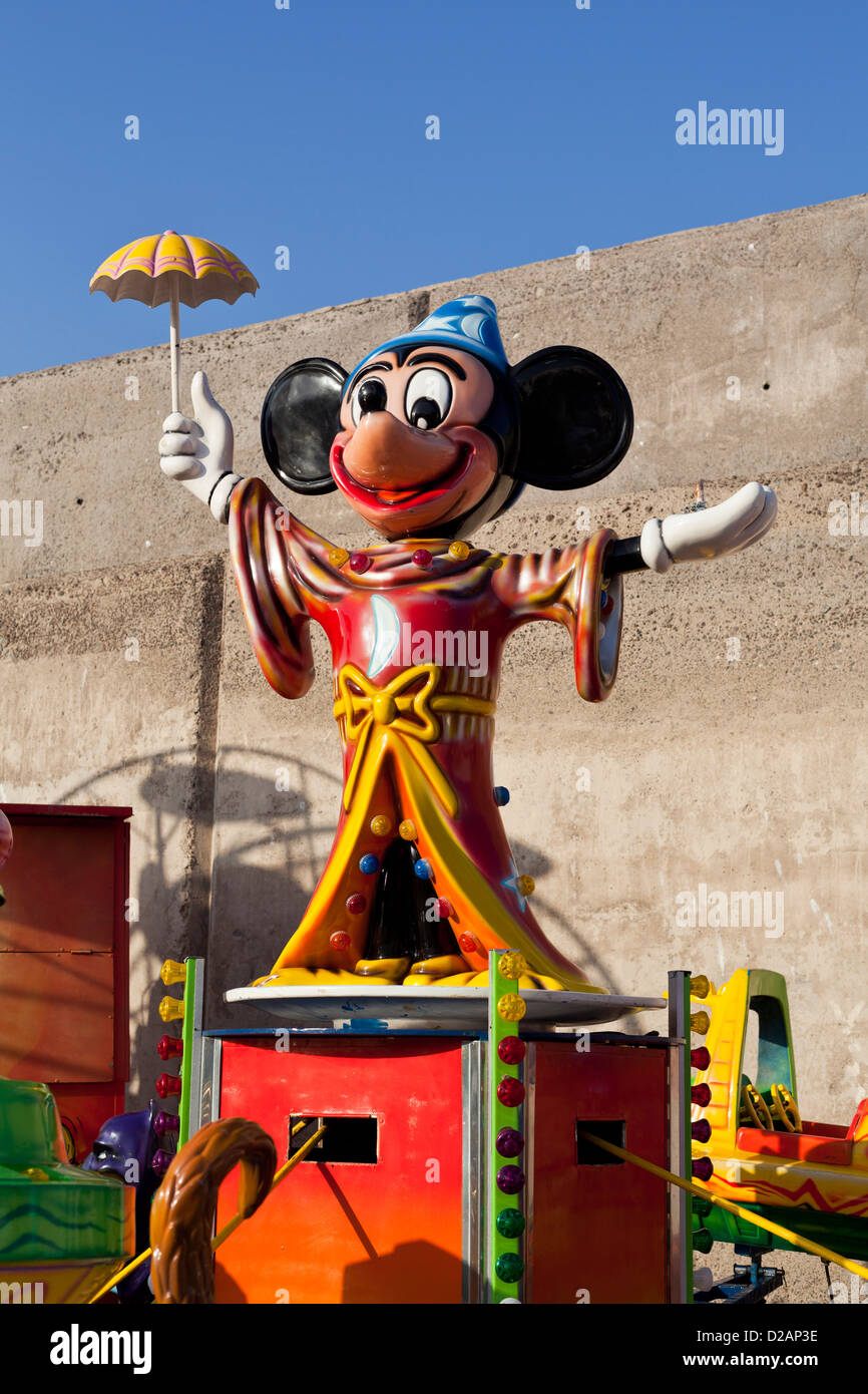Mickey Mouse character on a kiddies fairground ride at Playa San Juan ...