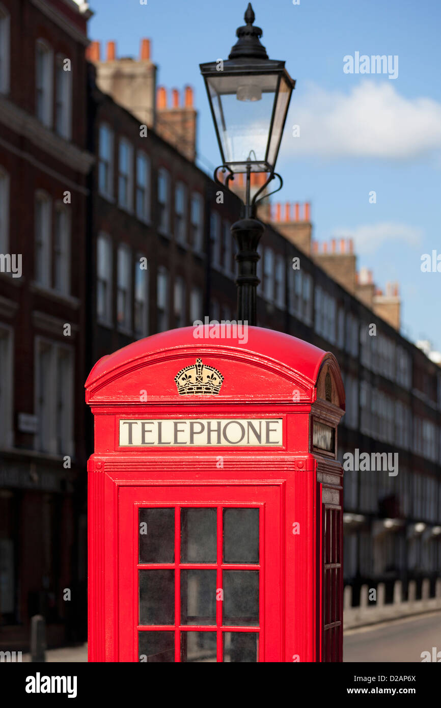 Red telephone box on city street Stock Photo - Alamy