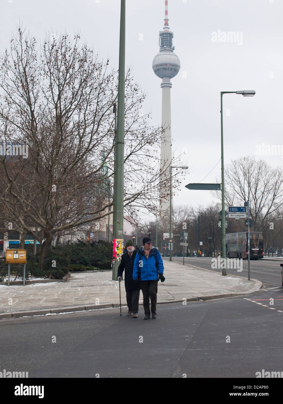 Two elderly men crossing street in Berlin near cathedral with ...